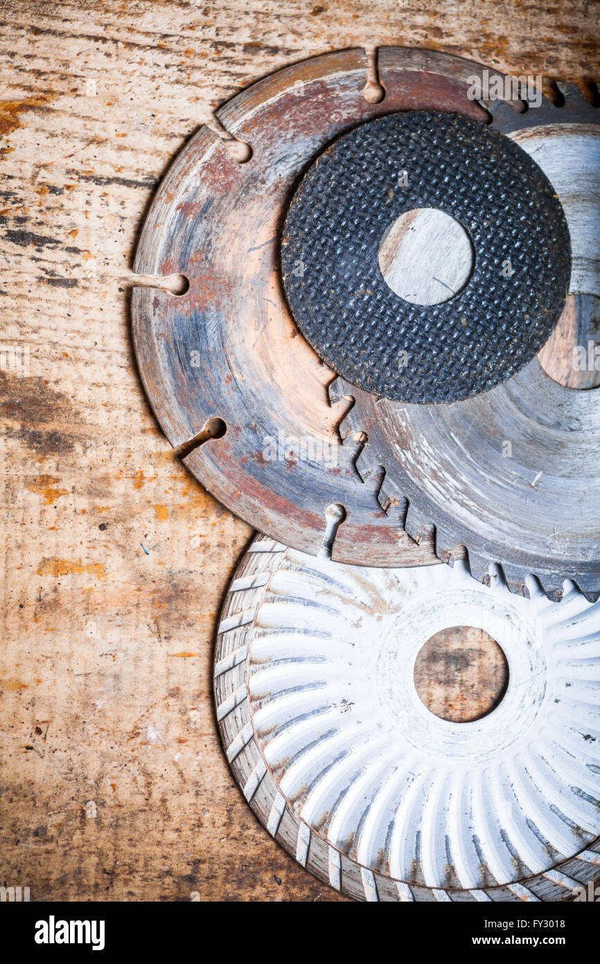 Color image of some cutting disks on a wooden plank Stock Photo - Alamy