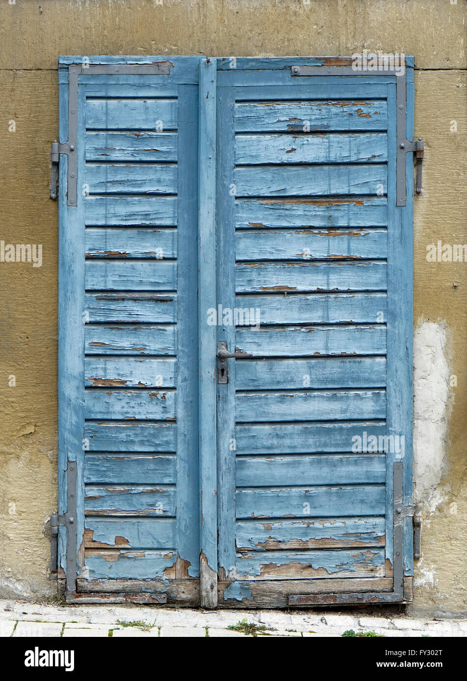 detail of a old rundown blue wooden door with blue flaking paint Stock ...