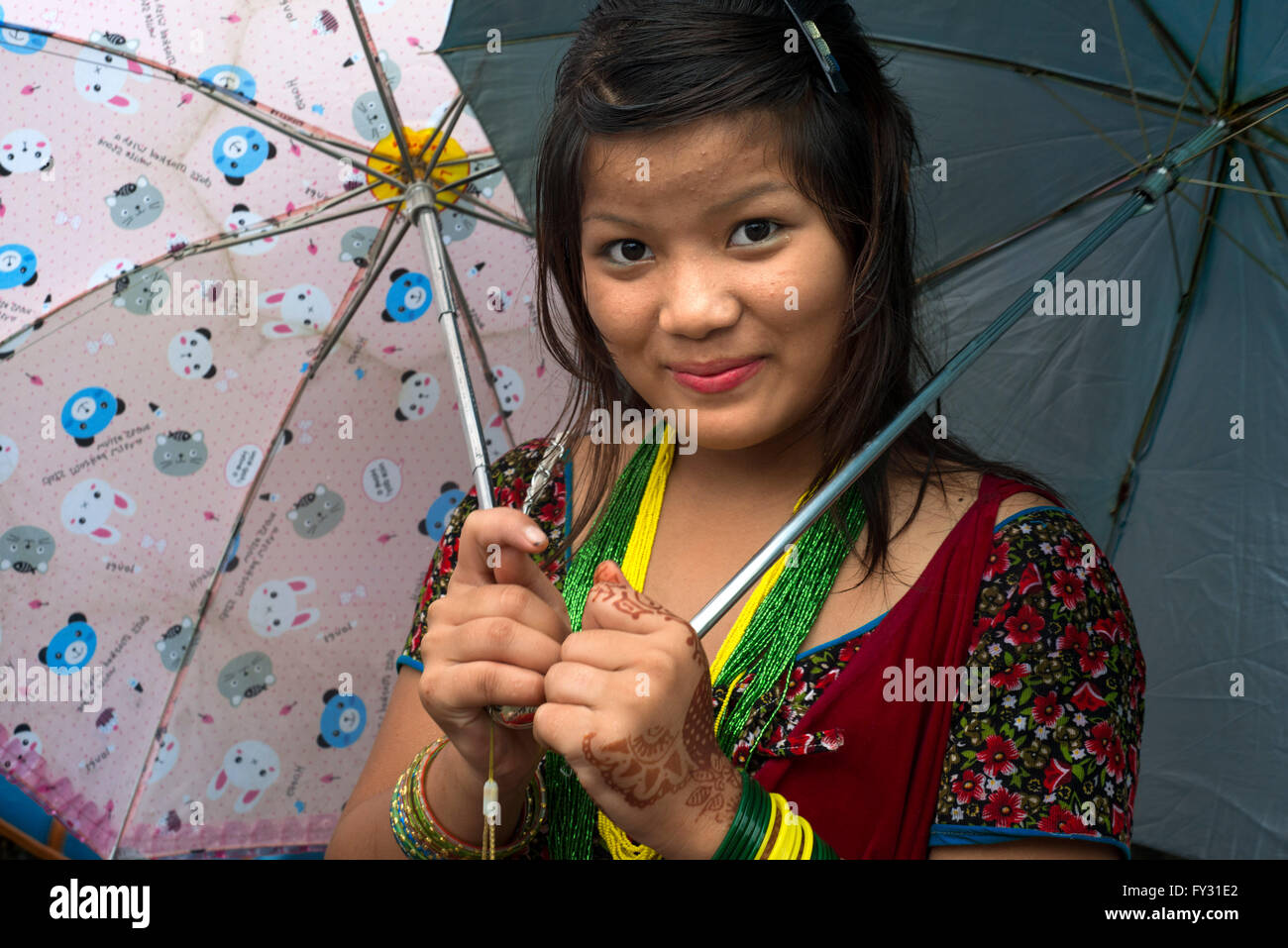 Portrait Of A Young Nepalese Girl With Umbrella Near Bandipur Hanging Bridge In Nepal Kathmandu