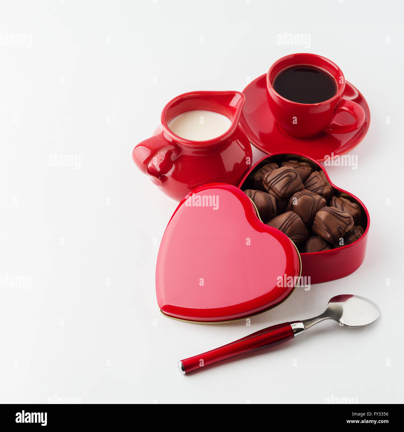 Coffee with milk, chocolate candy. Isolated on white background Stock ...