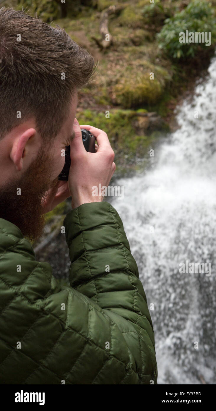 Photographer taking picture Stock Photo - Alamy