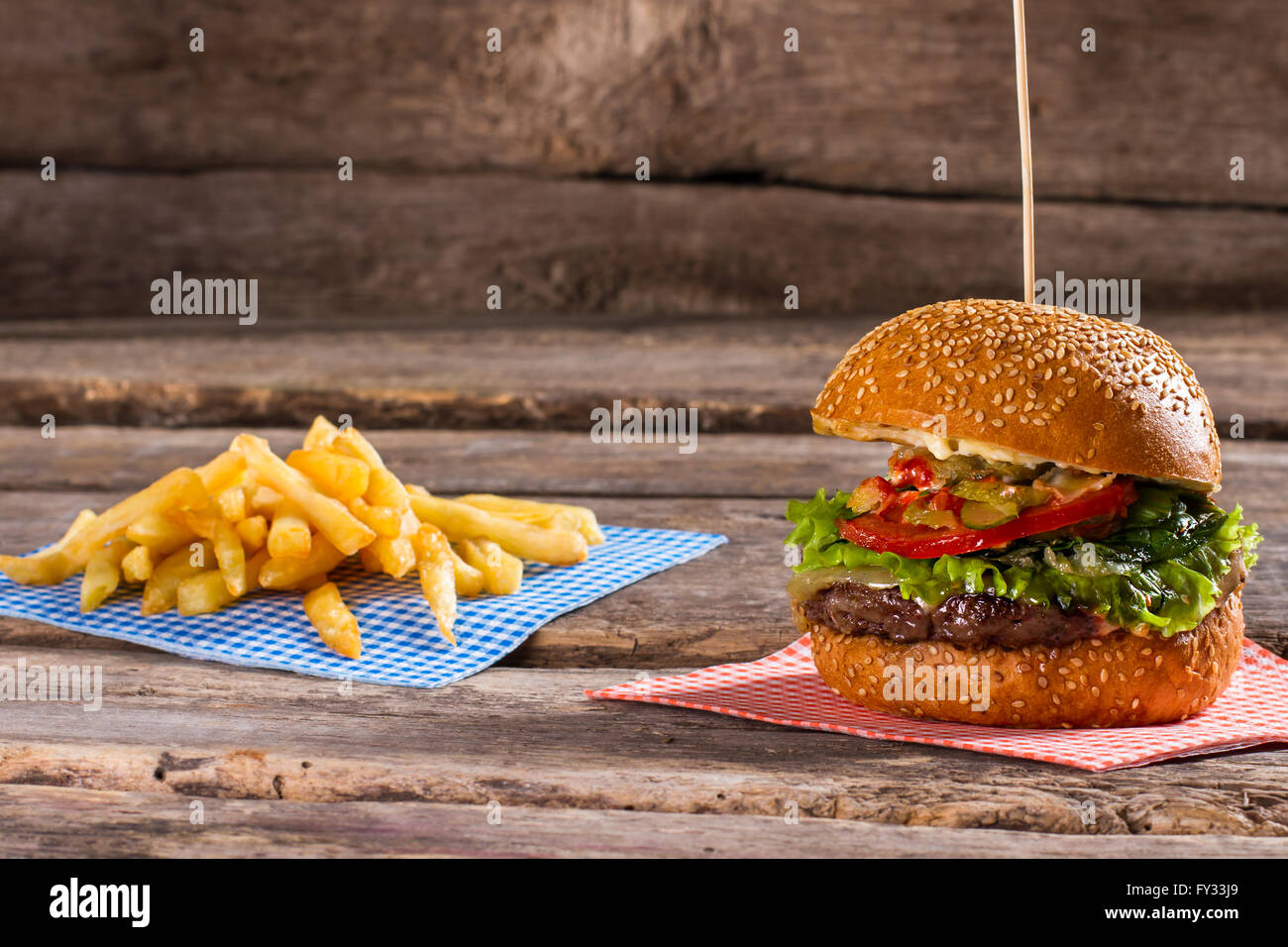Burger and pile of fries Stock Photo - Alamy