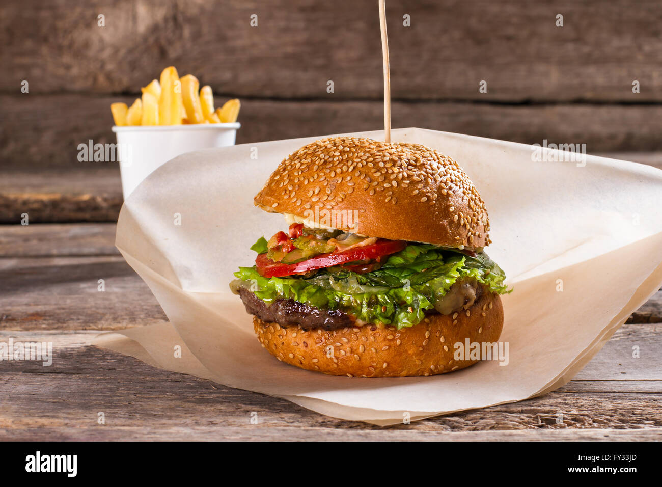 Burger on wax paper Stock Photo - Alamy