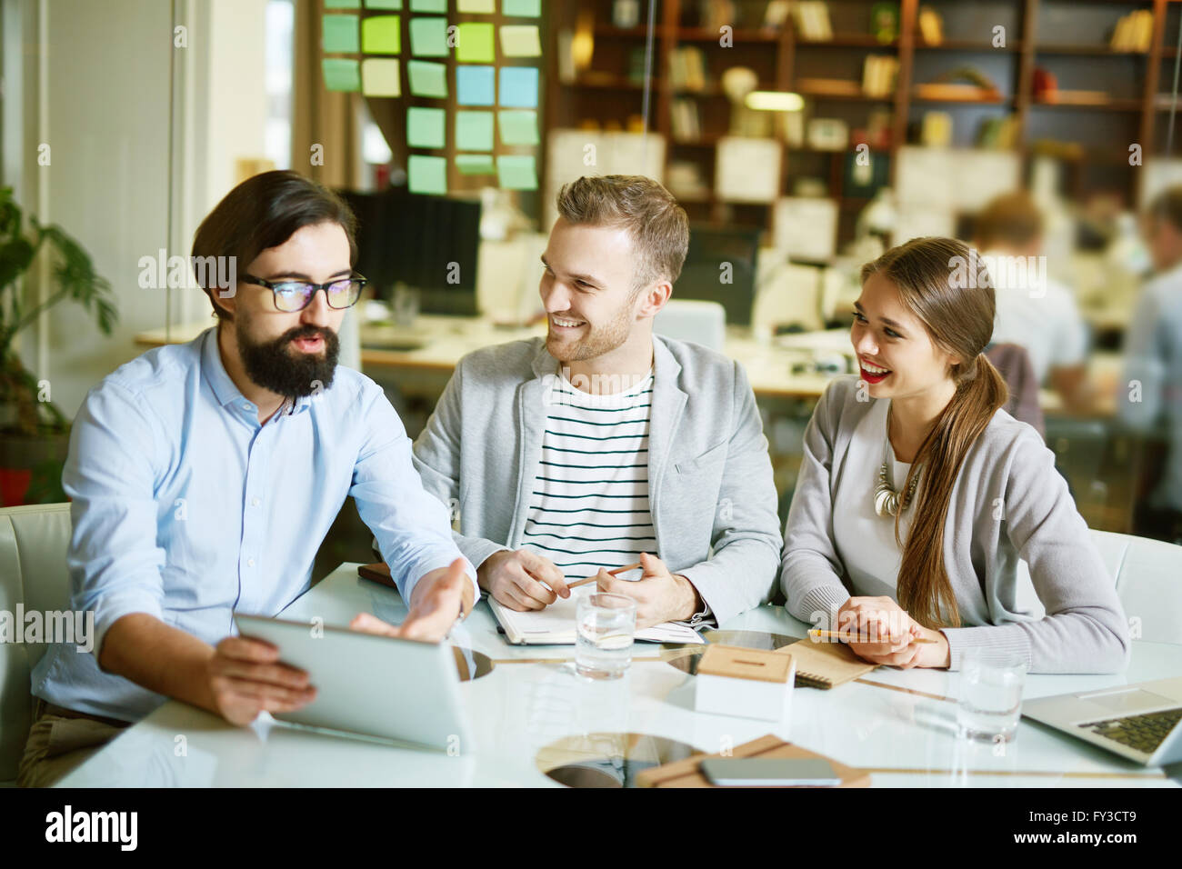 Instructing young colleagues Stock Photo - Alamy