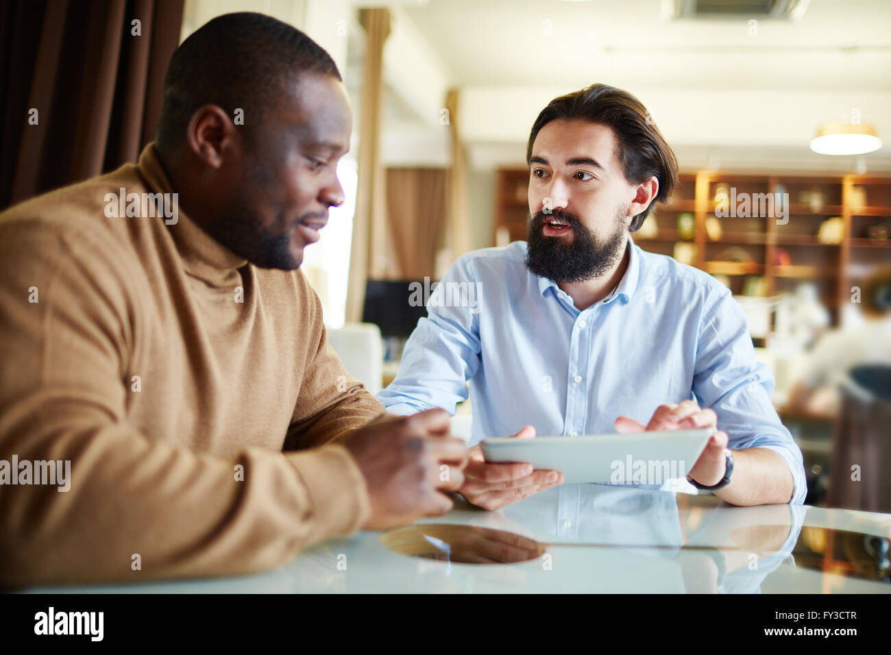 Conversation with employee Stock Photo - Alamy