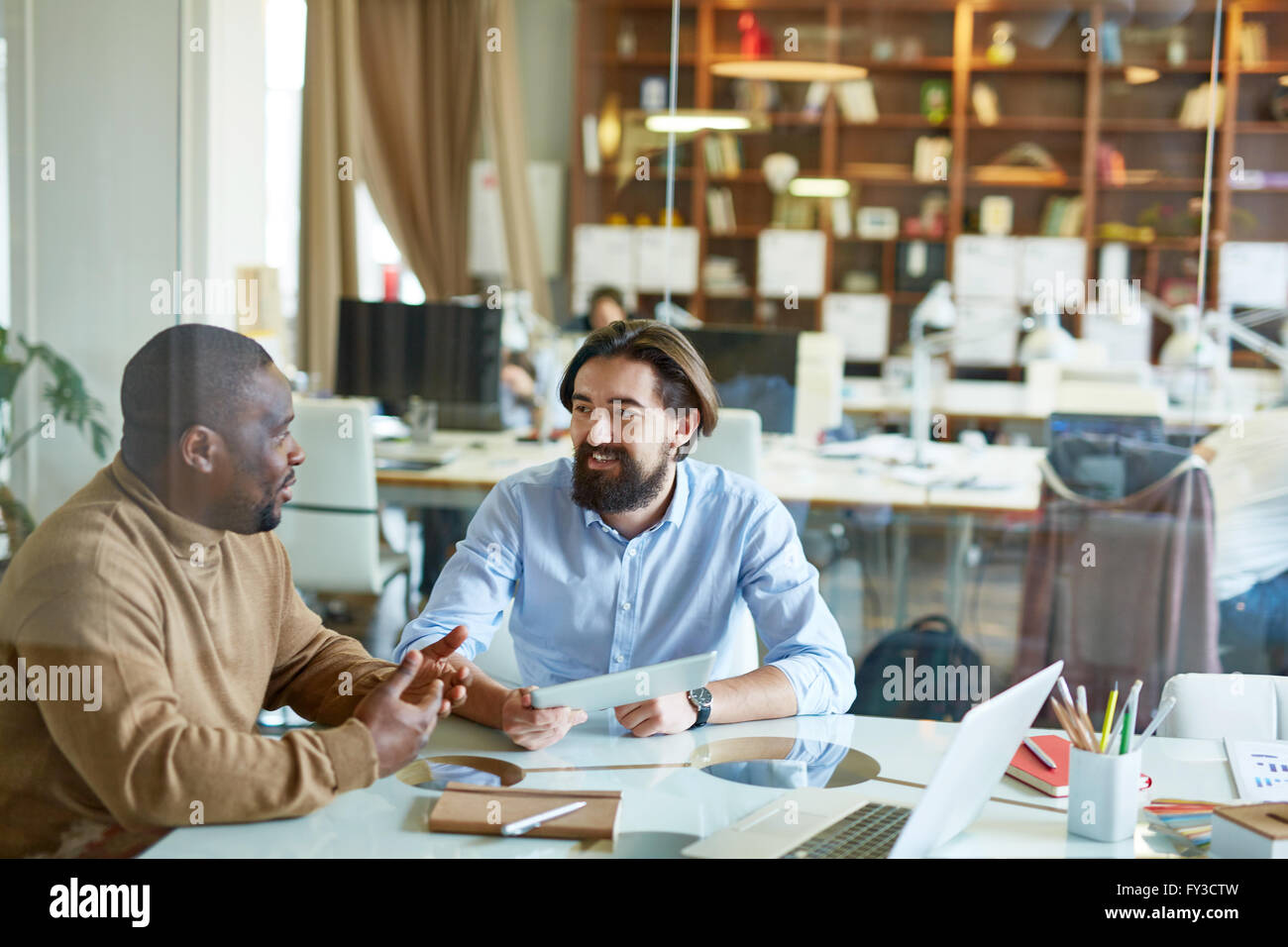 Communication of men in office Stock Photo - Alamy