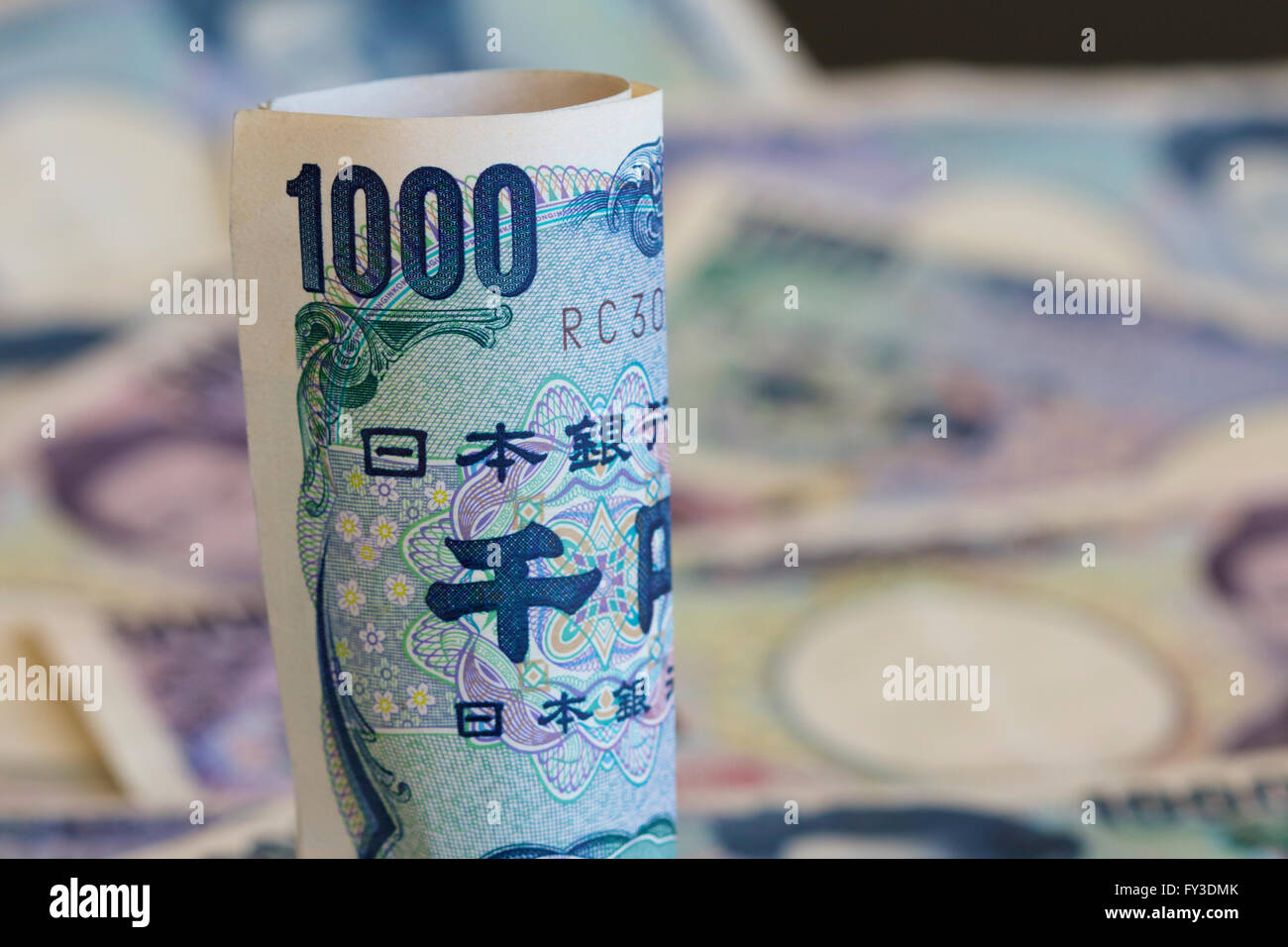 Japanese notes with a background of cash Stock Photo - Alamy