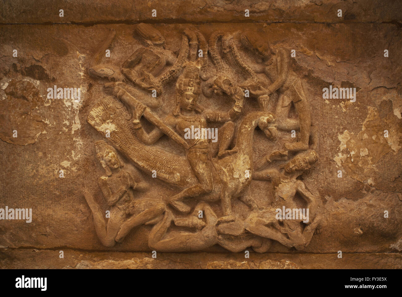 Carved figure of Kartikeya (Ganesha's brother) seated on his vehicle ...