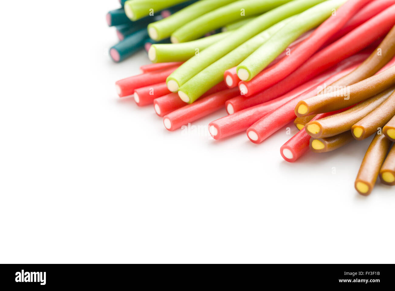 Sweet gummy sticks with different flavor. Tasty candies isolated on ...