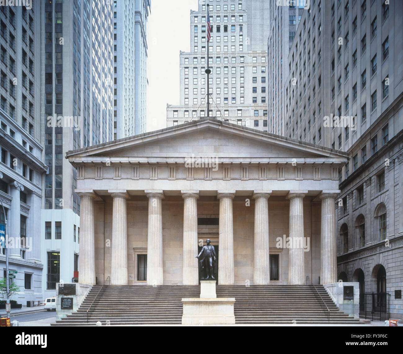 USA, New York City, Manhattan, Federal Hall National Monument, portico facade and statue of ...