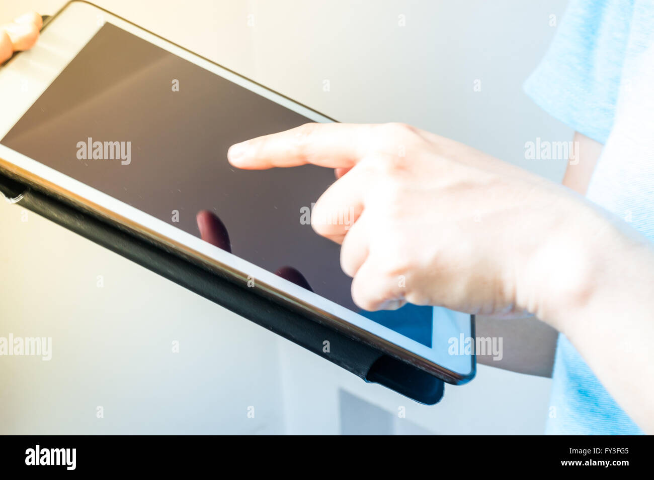 Hand holding digital tablet beside the window, stock photo Stock Photo ...