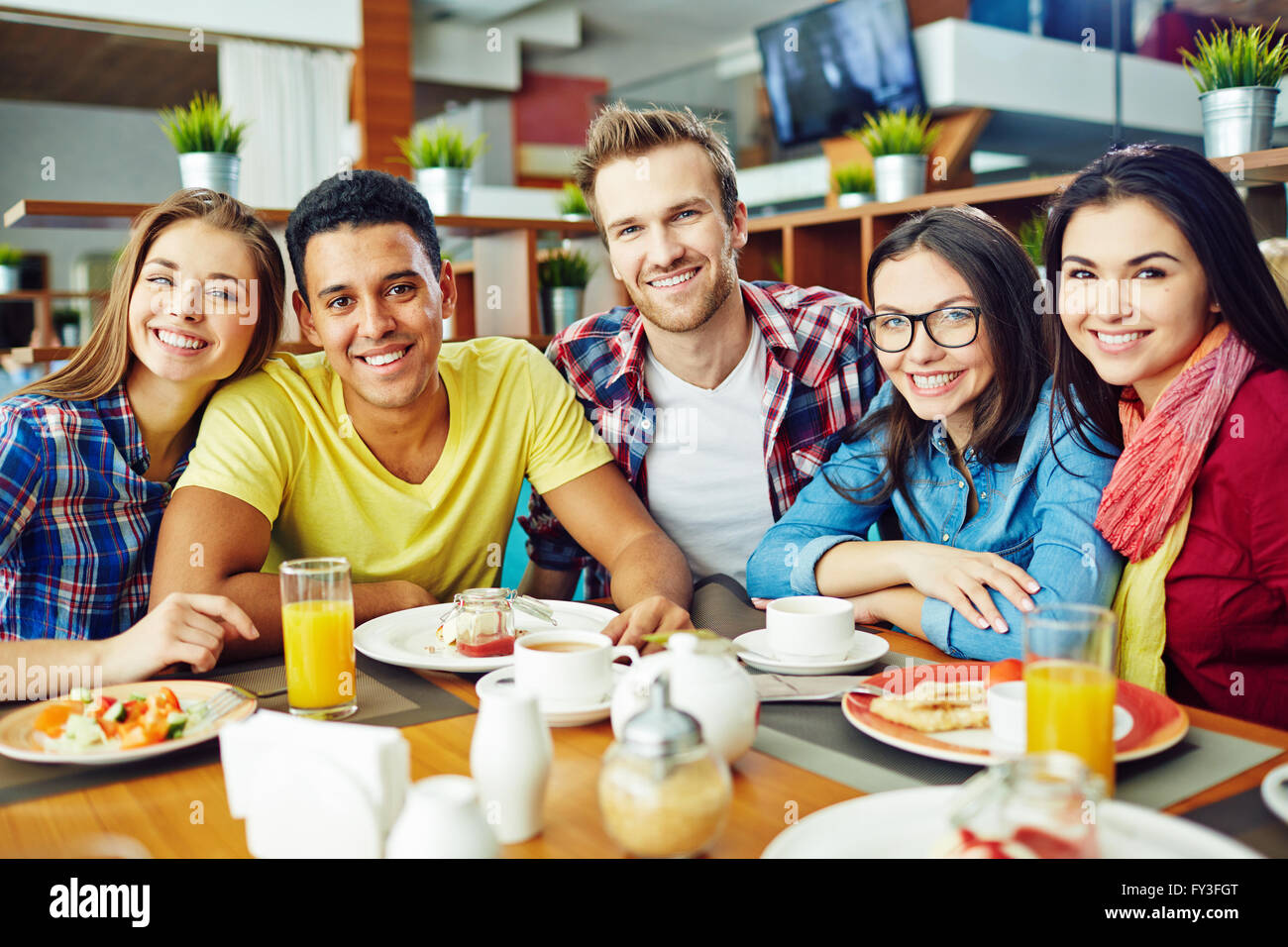 Portrait of friends in cafe Stock Photo - Alamy