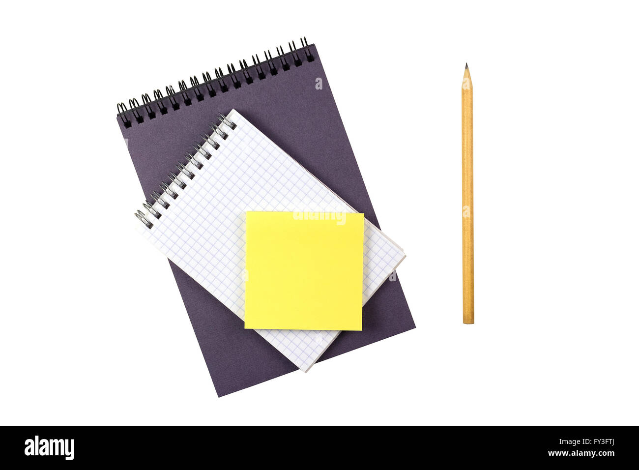 two Notepad with a pencil and yellow stickers on a white background ...