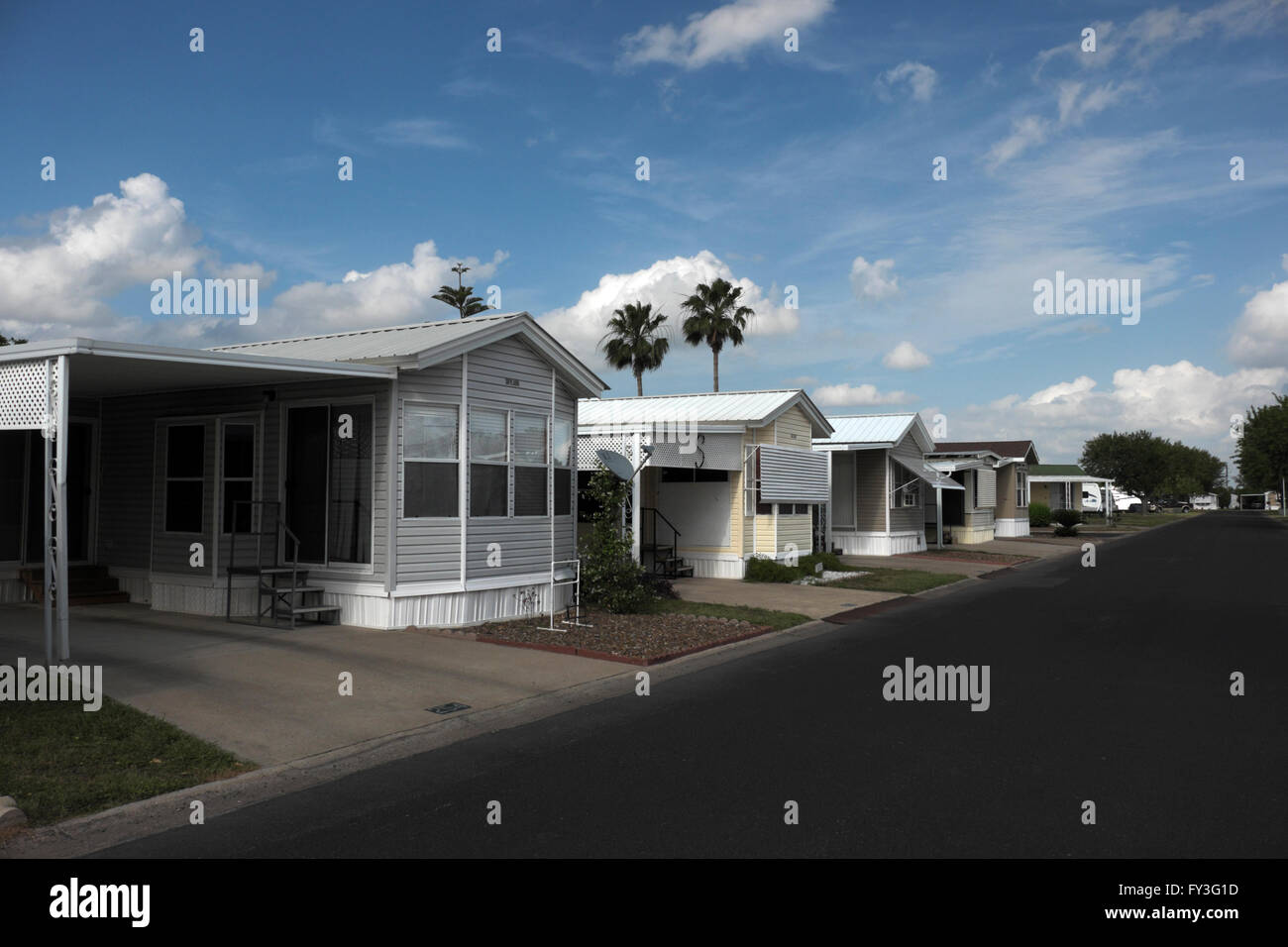 Travel trailers, fifth wheels, mobile homes and park models sit ...