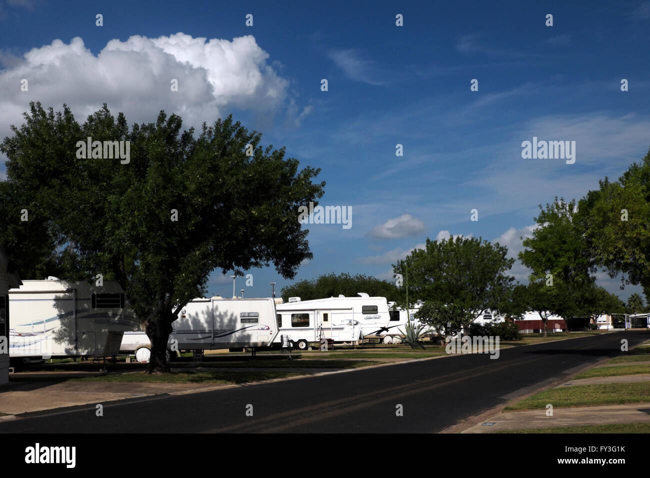 Travel trailers, fifth wheels, mobile homes and park models sit ...