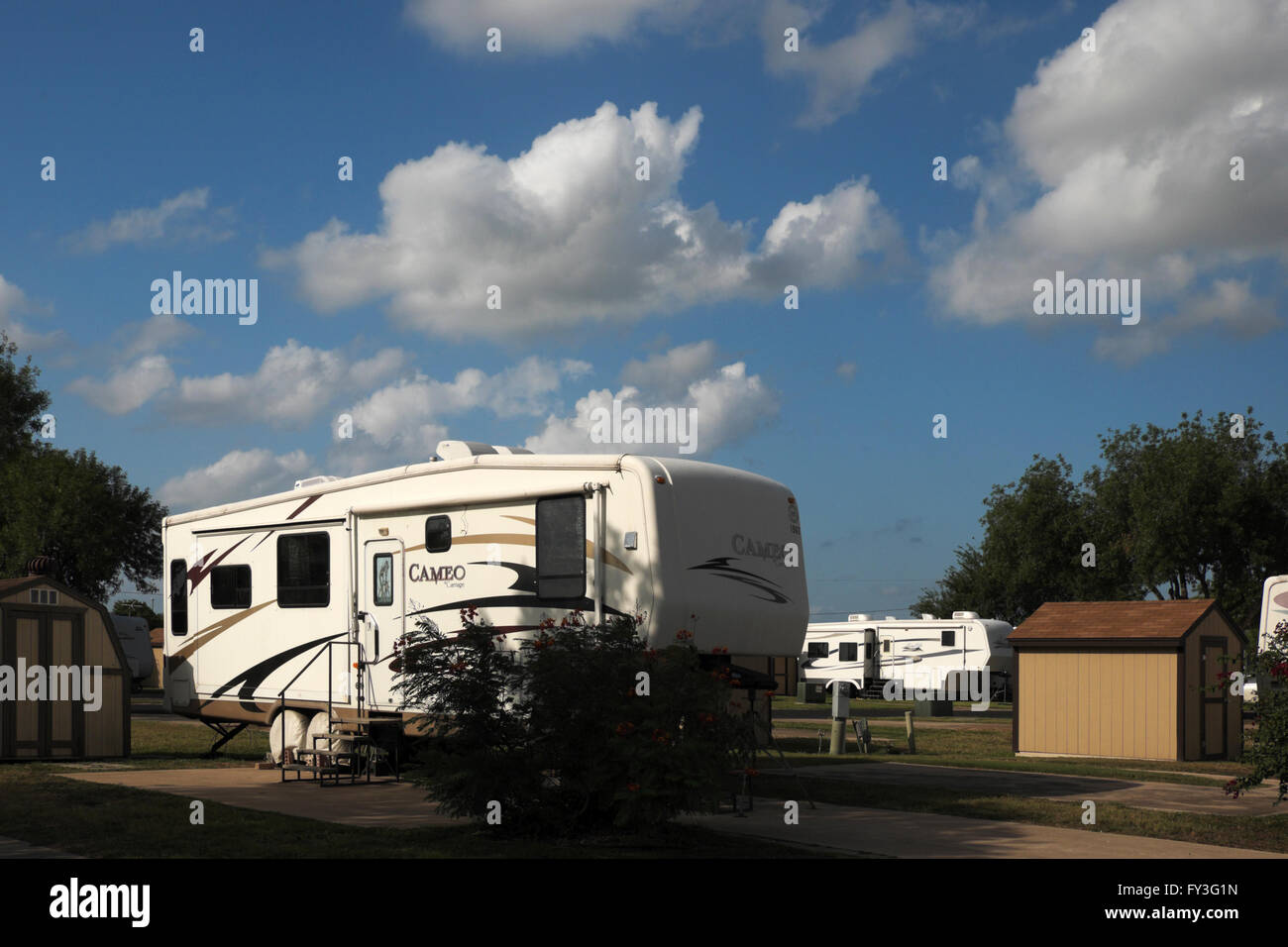 Travel trailers, fifth wheels, mobile homes and park models sit ...