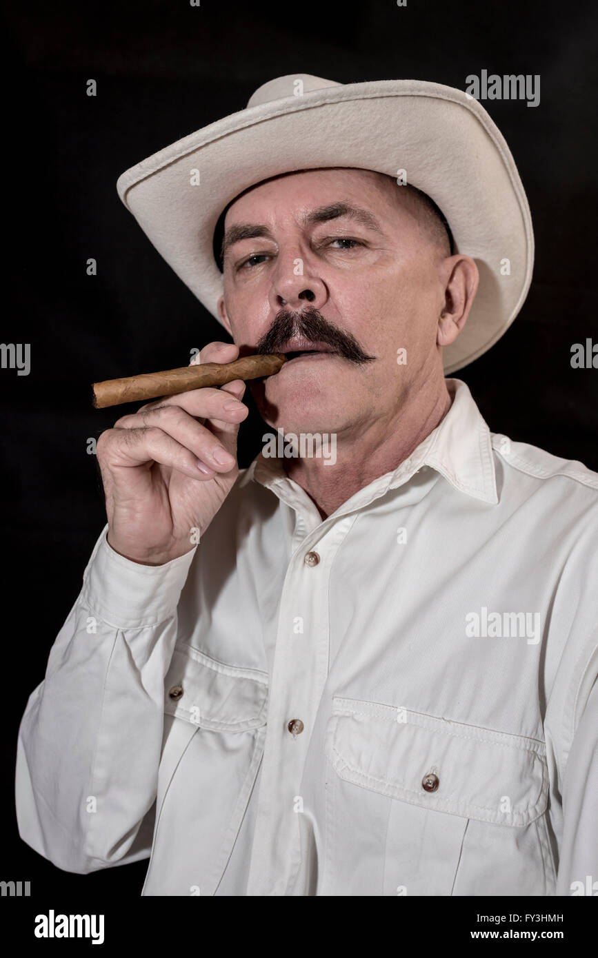 Cowboy with mustache smoking cigar hi-res stock photography and images ...