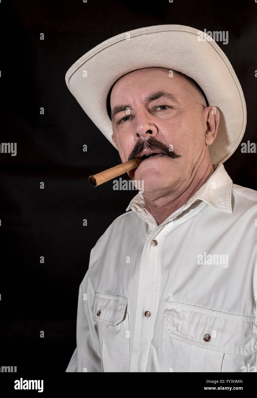 Cowboy with mustache smoking cigar hi-res stock photography and images ...