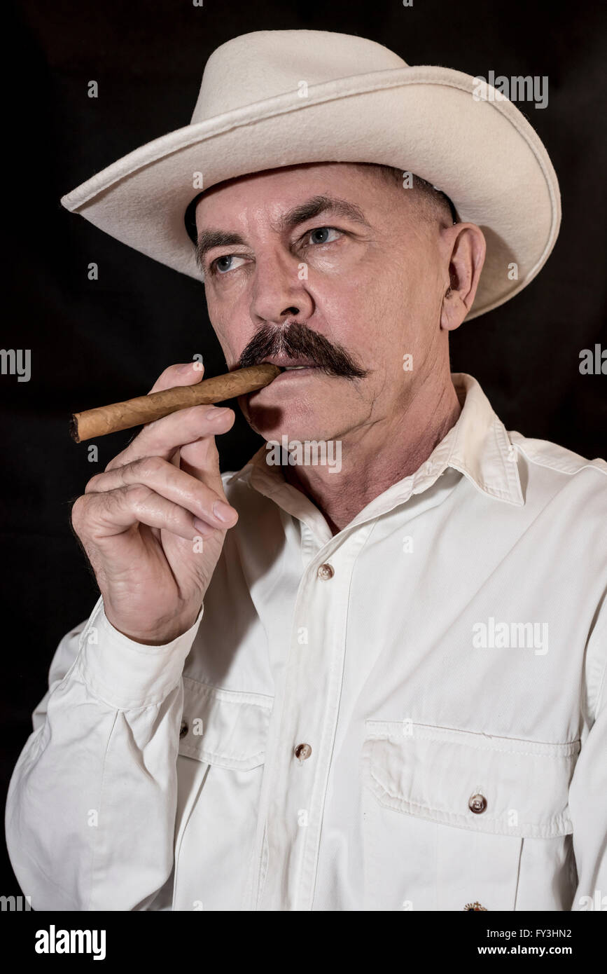 Cowboy smoking a pipe hi-res stock photography and images - Alamy