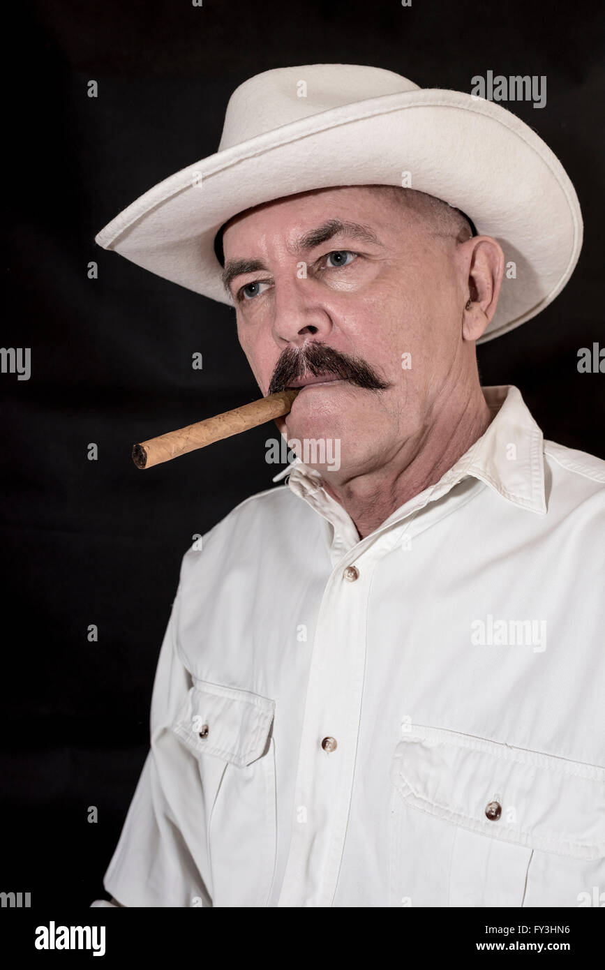 Cowboy with mustache smoking cigar hi-res stock photography and images ...