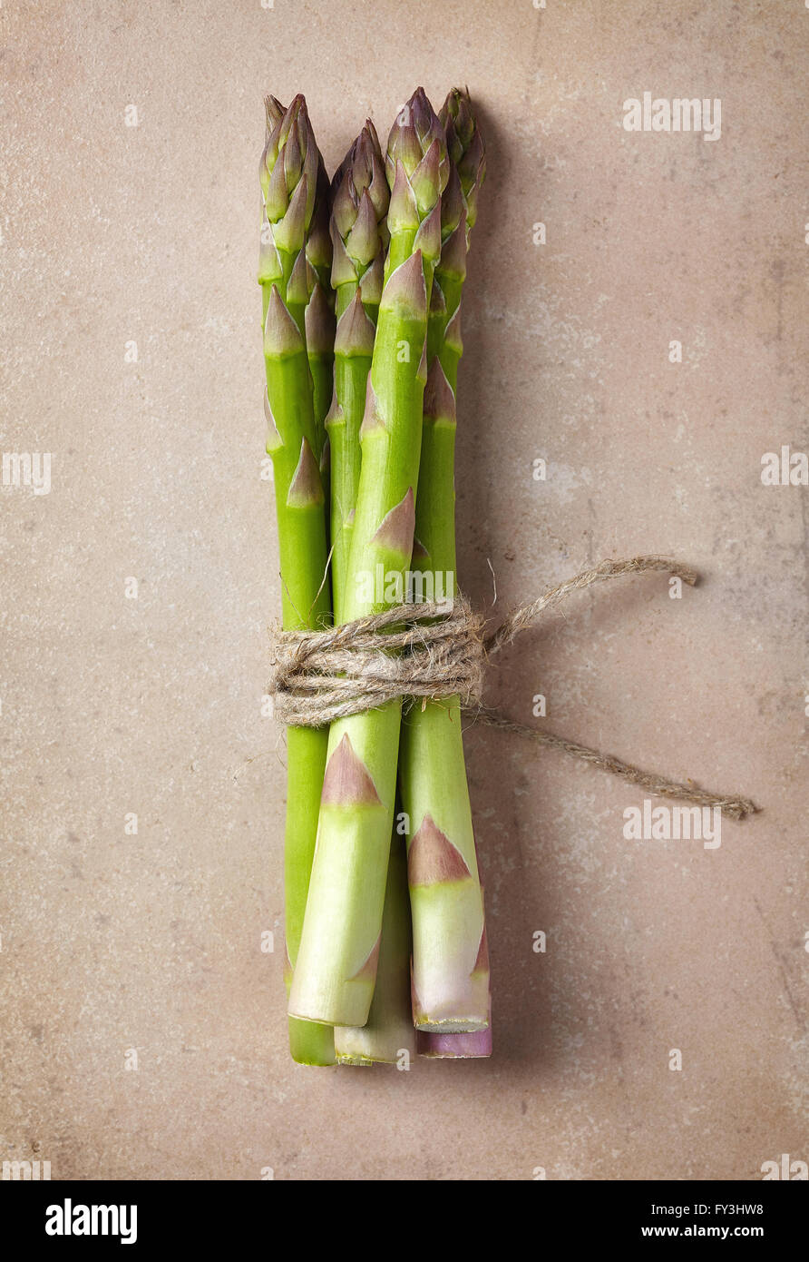 Portion of fresh asparagus on stone table; top view Stock Photo - Alamy