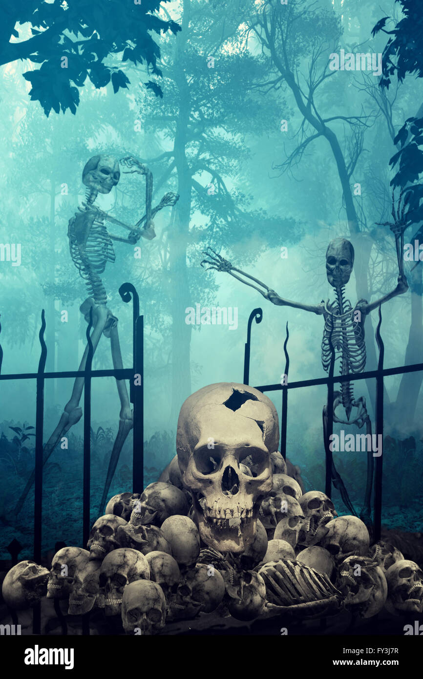 Skulls and Skeletons in creepy graveyard Stock Photo - Alamy