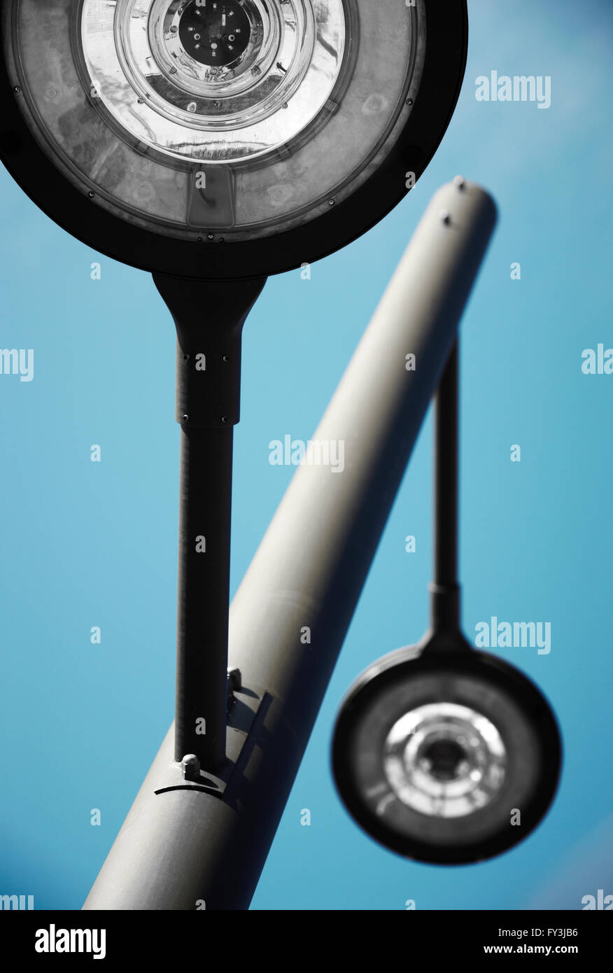 Modern street lamp under a blue sky. Vertical format Stock Photo - Alamy