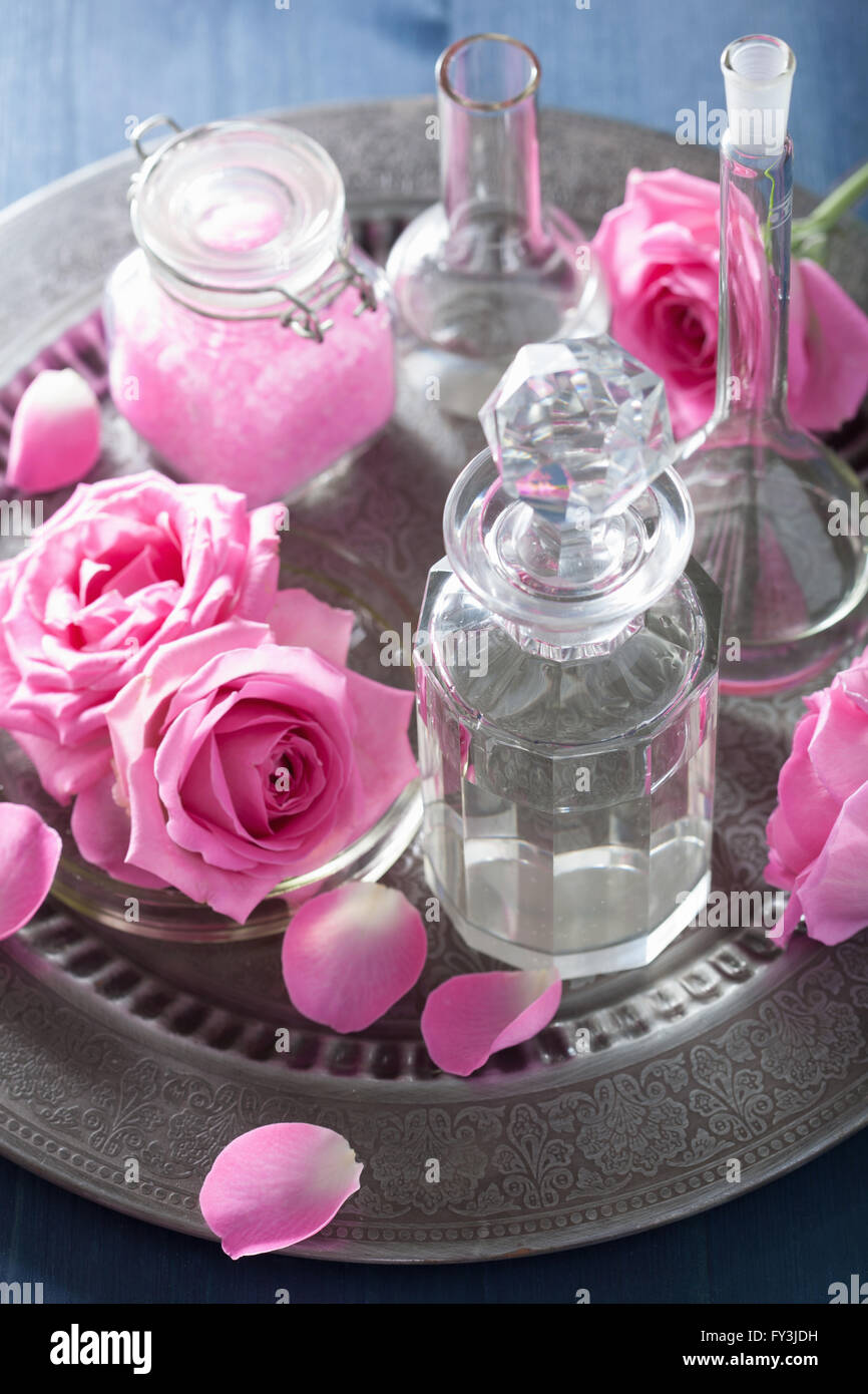 alchemy and aromatherapy with rose flowers and chemical flasks Stock ...