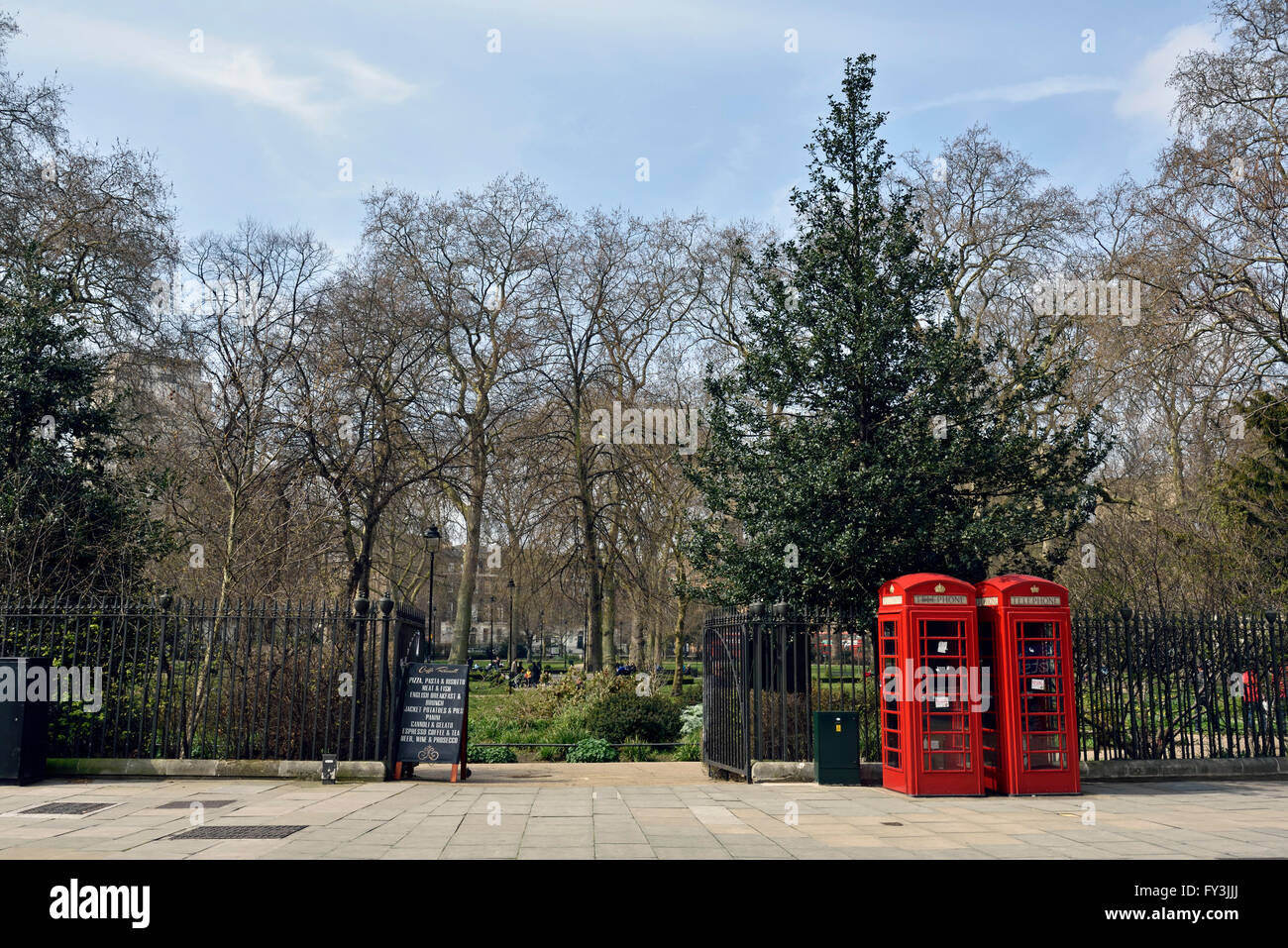 Entrance Russell Square with two red telephone boxes Bloomsbury London ...