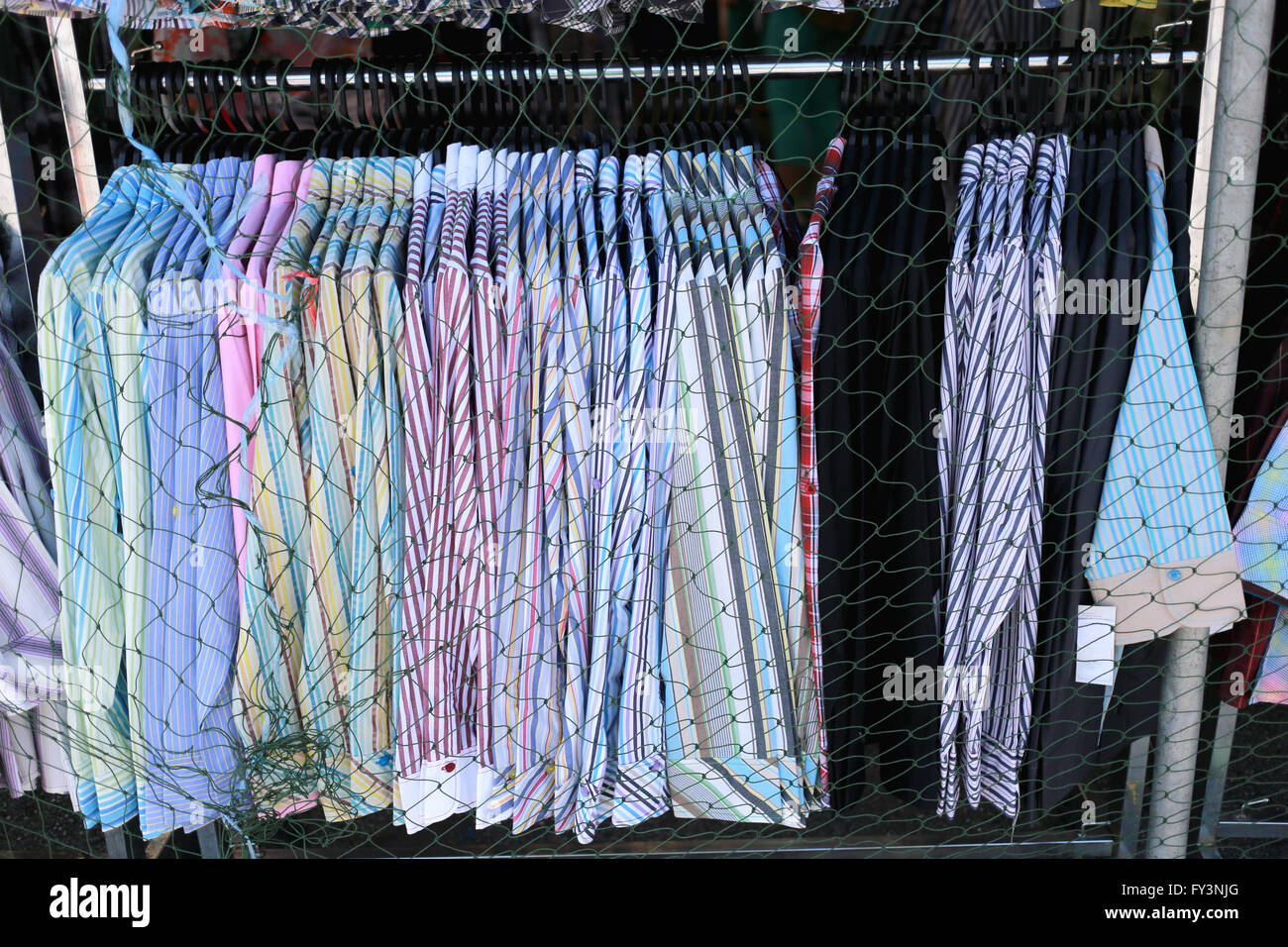 clothes fashion is hanging clothesline in shop wear and a nets blocking ...