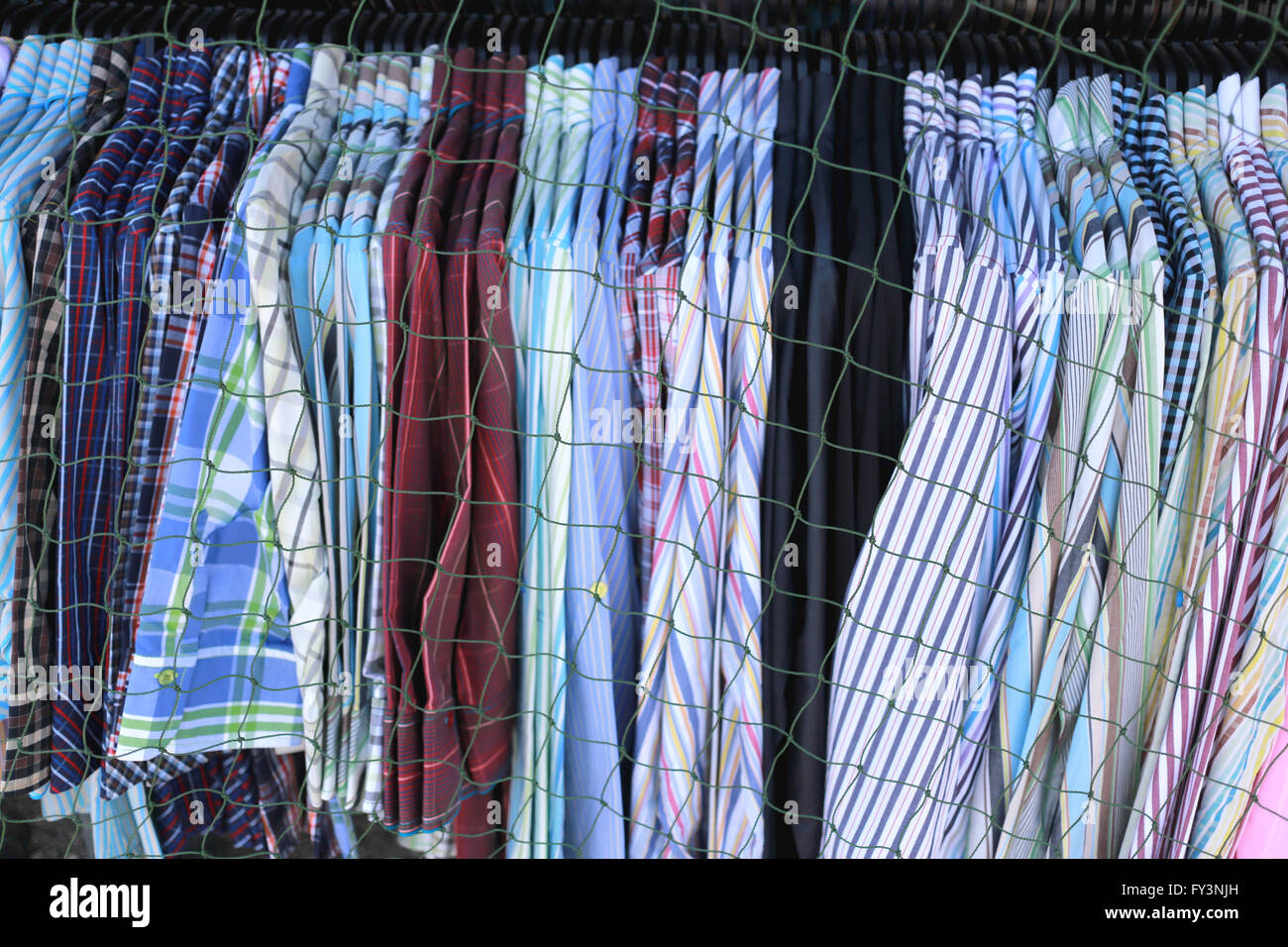 clothes fashion is hanging clothesline in shop wear and a nets blocking ...