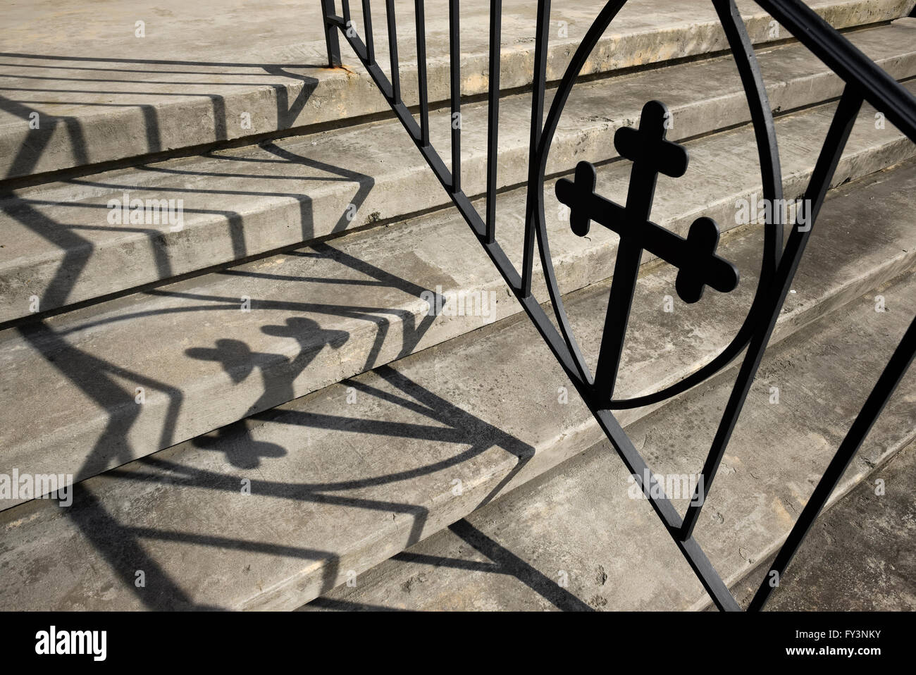 Metal cross in ironwork of handrail on steps of church Stock Photo - Alamy