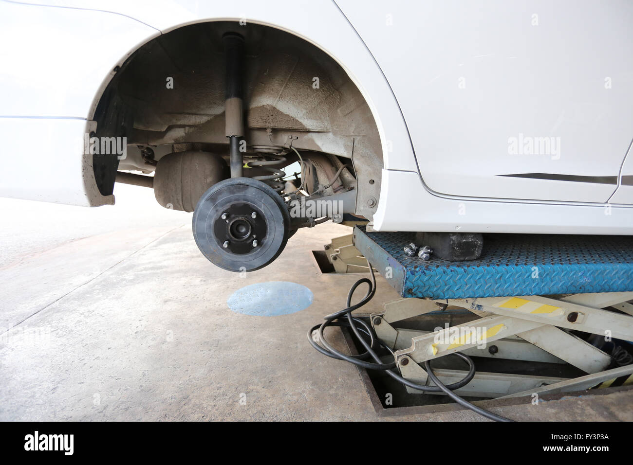Wheel hub of a car in repair of the damage,Garage shop Stock Photo - Alamy