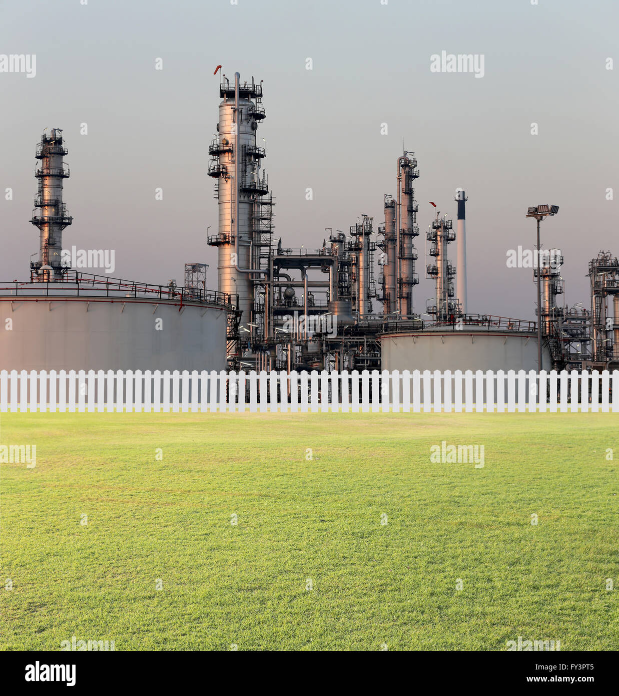 Oil refinery and green lawn with white fence barrier zoning Prohibited ...