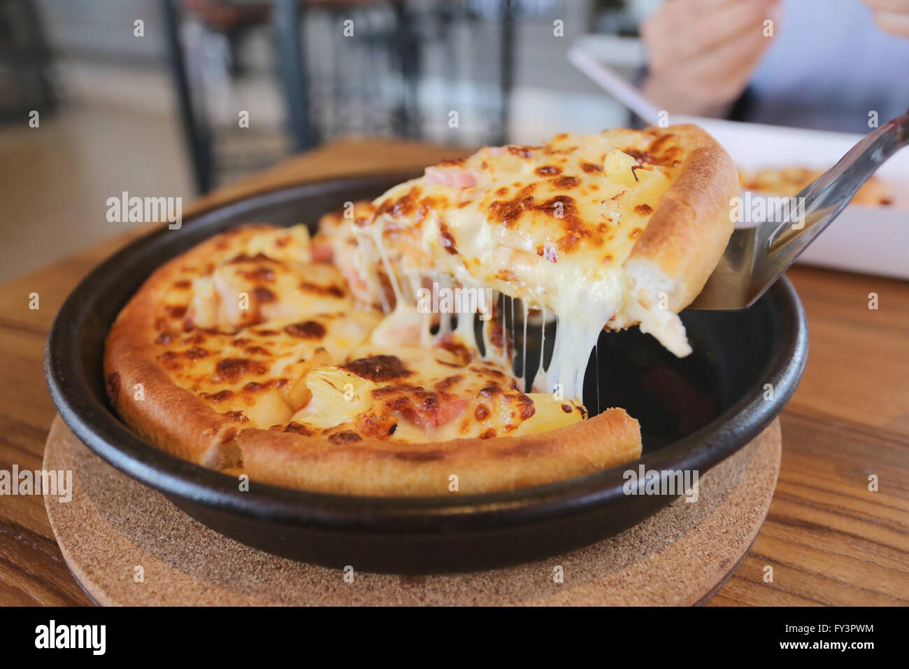 traditional of hot cheese pizza on pan in the restaurant Stock Photo ...