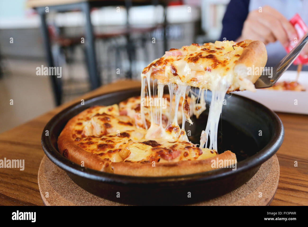 traditional of hot cheese pizza on pan in the restaurant Stock Photo ...