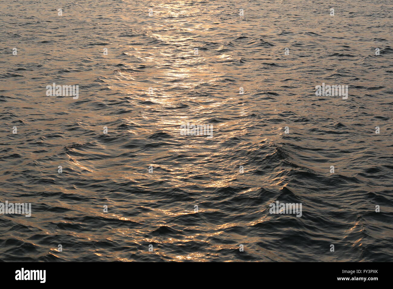 Waves in sea and light of sunset for the background naturally Stock ...