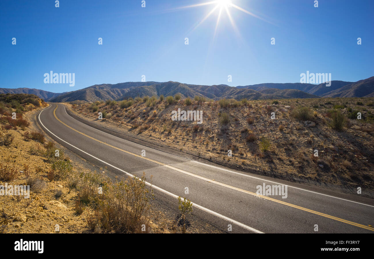 Empty desert highway through the vast Mojave of southern California ...