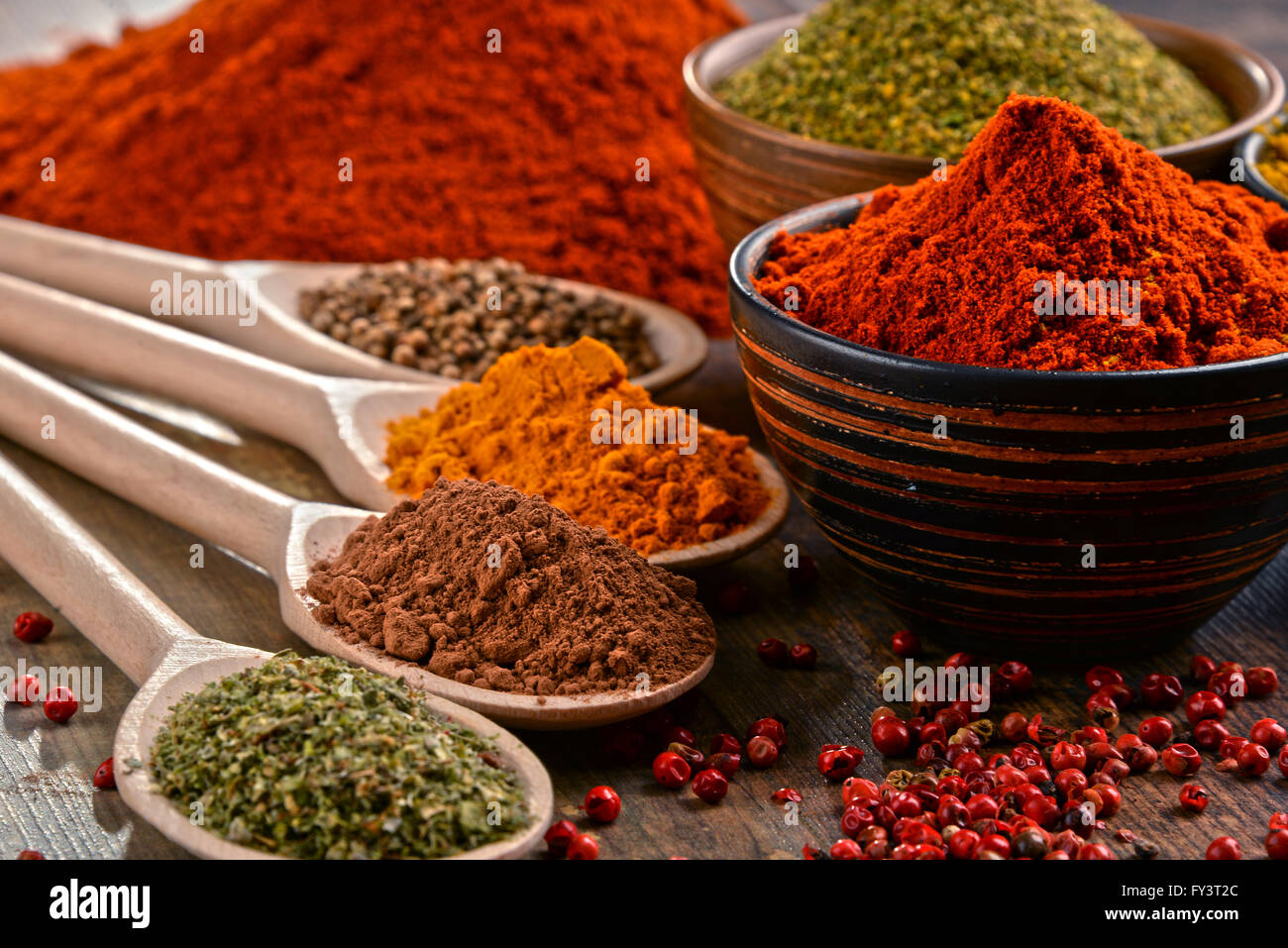 Variety of spices on kitchen table Stock Photo - Alamy