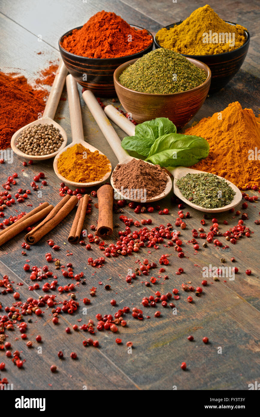 Variety of spices on kitchen table Stock Photo - Alamy