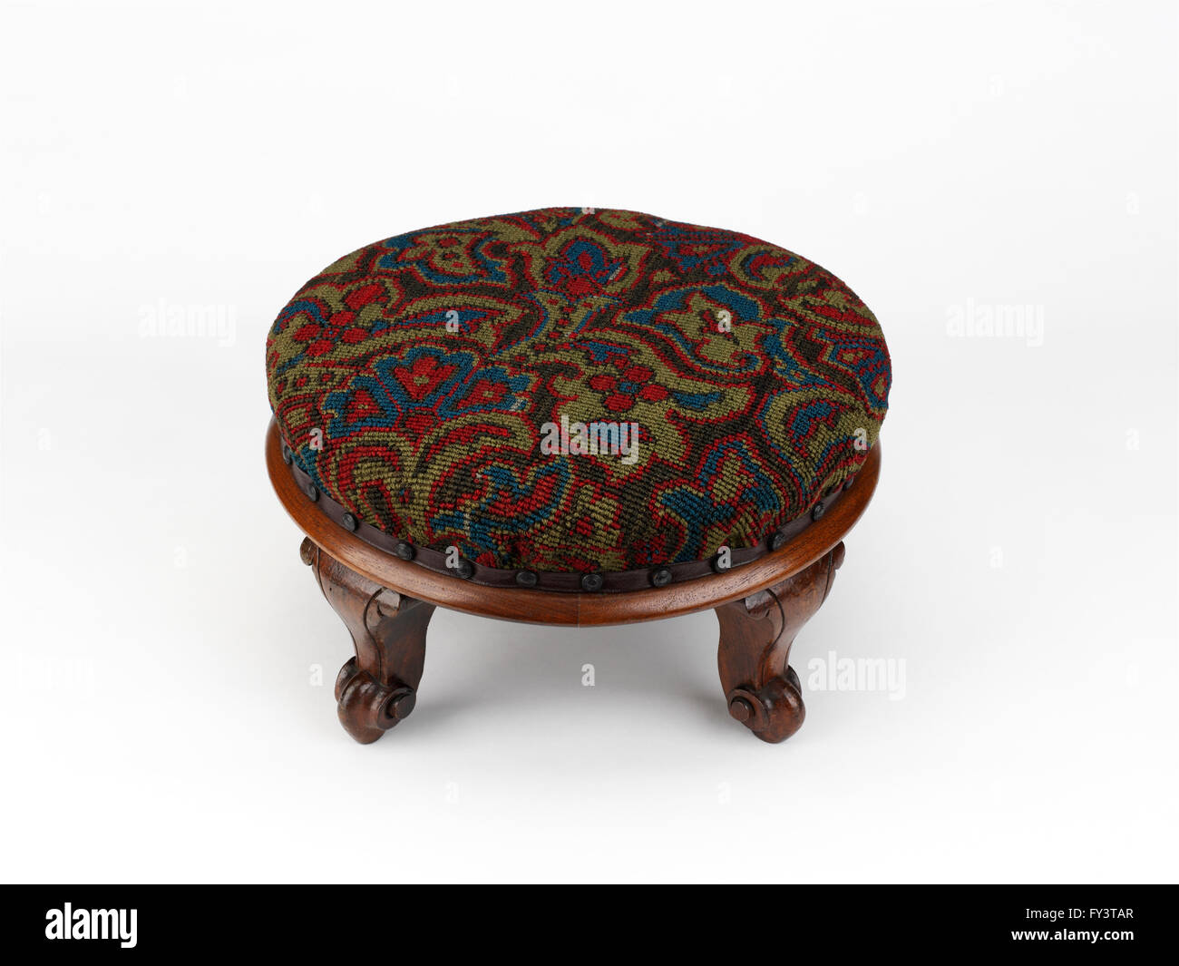 Circular footstool with wooden base and detachable beaded cover Stock ...