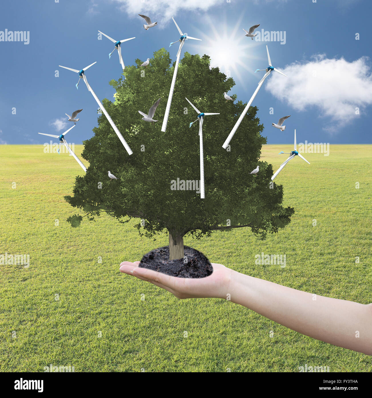 Big Tree grown in the hand and have wind turbine on fine weather ...
