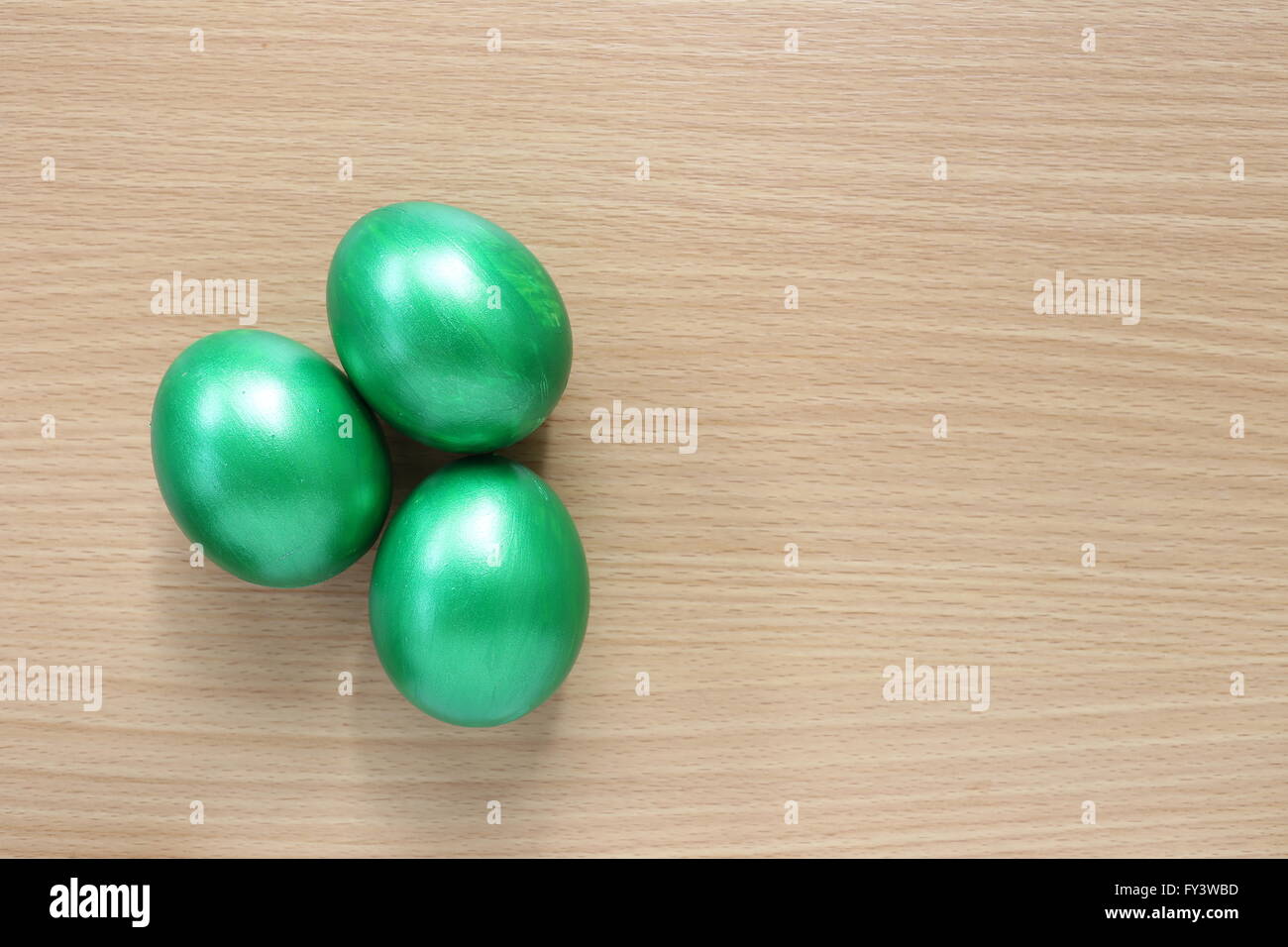 green of easter eggs on wood background,Handmade painted for design ...