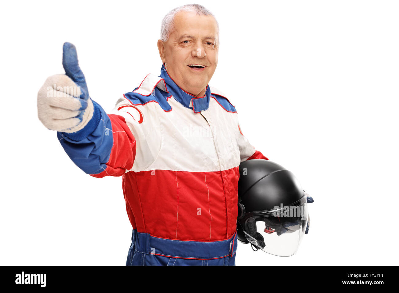 Mature car racer holding a helmet and giving a thumb up isolated on ...