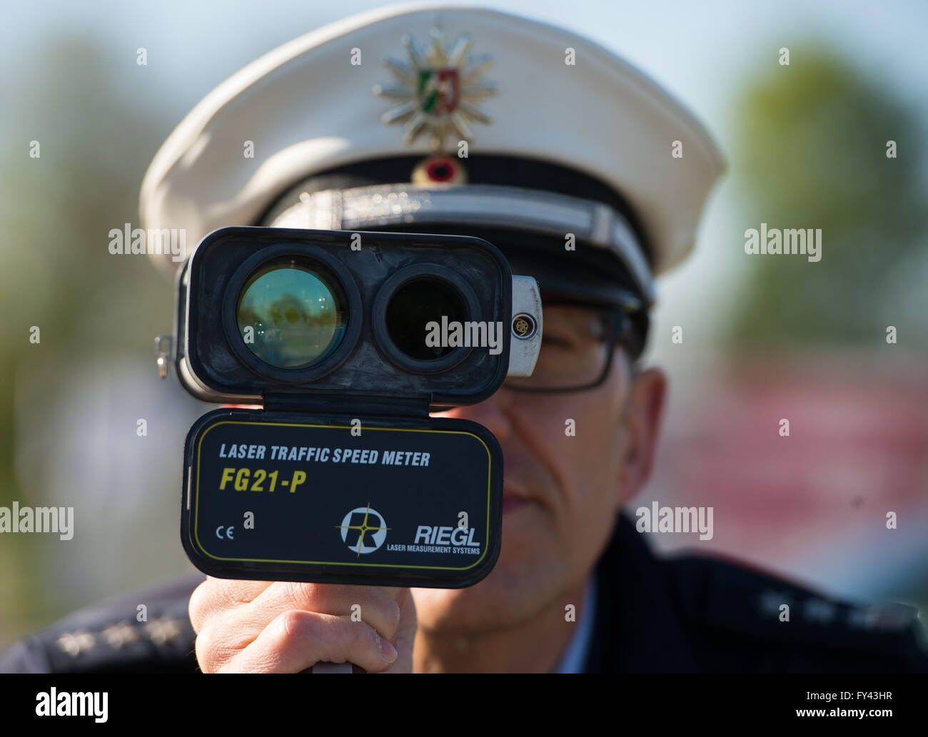Police officer Dirk Weyer looks through a speed scanner during speed ...