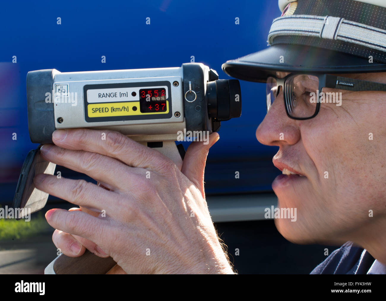 Police officer Dirk Weyer looks through a speed scanner during speed ...