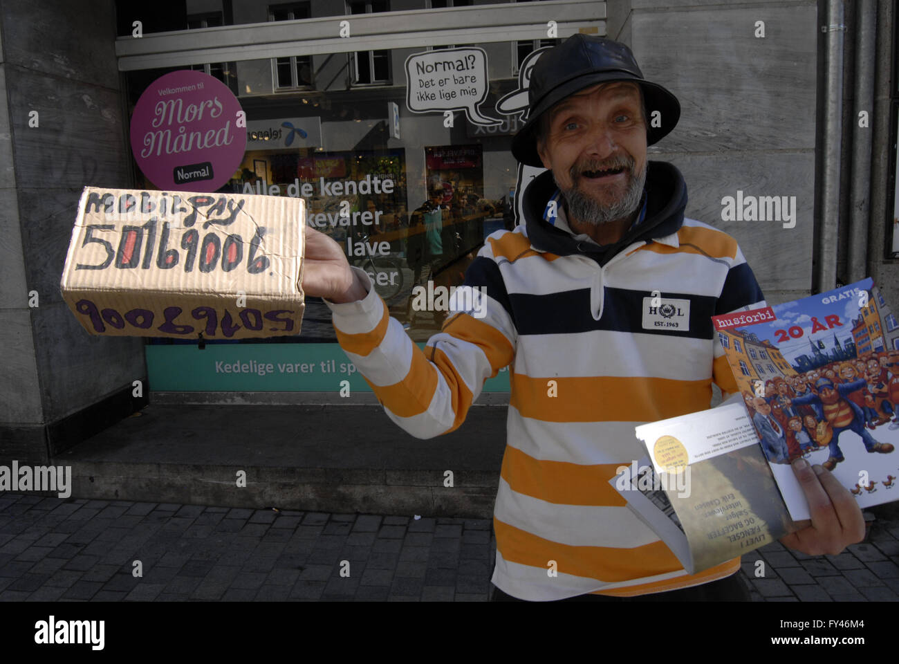 Copenhagen, Denmark. 21st April, 2016. Male selling homeless magazine ...