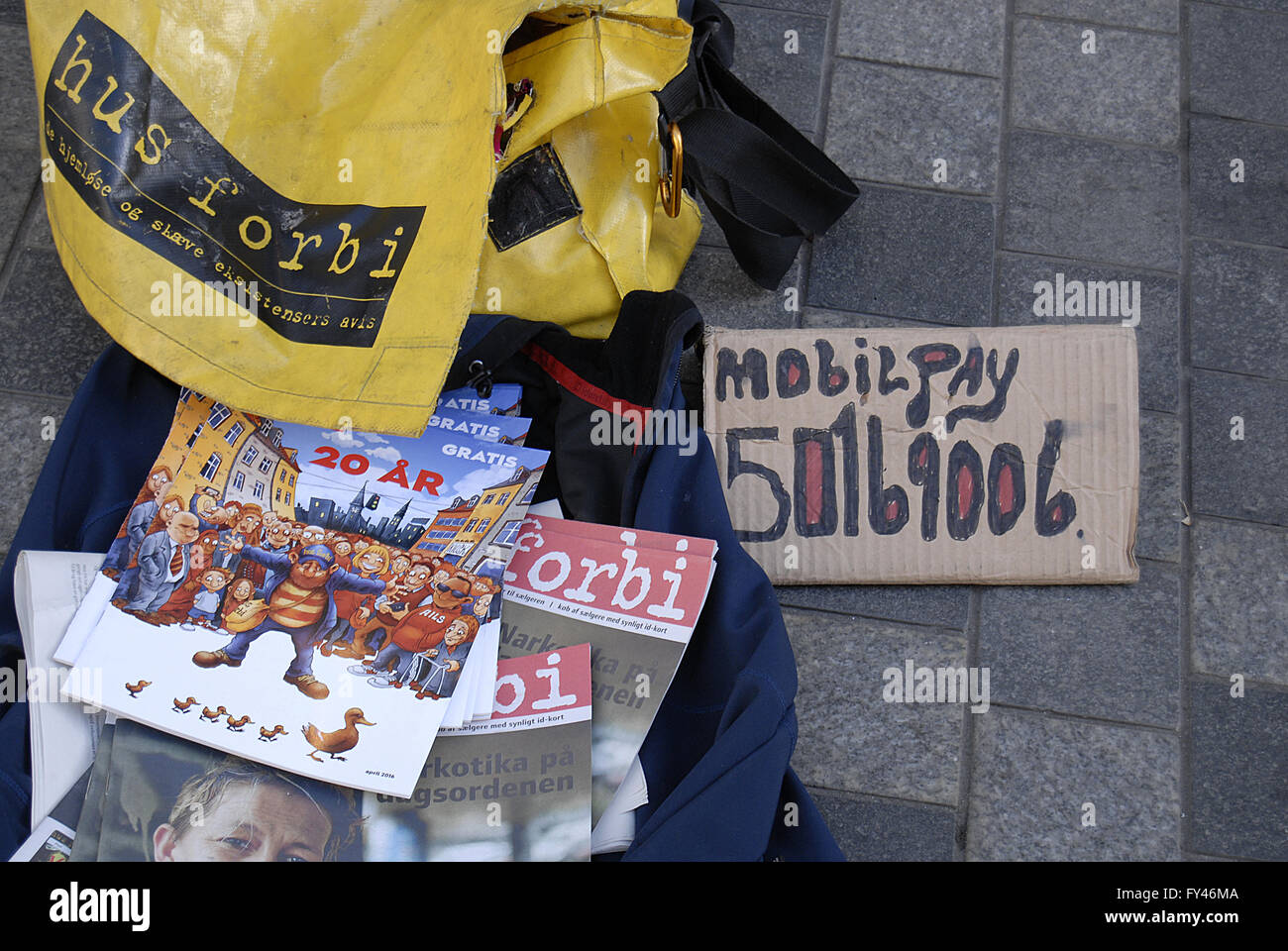 Copenhagen, Denmark. 21st April, 2016. Male selling homeless magazine ...