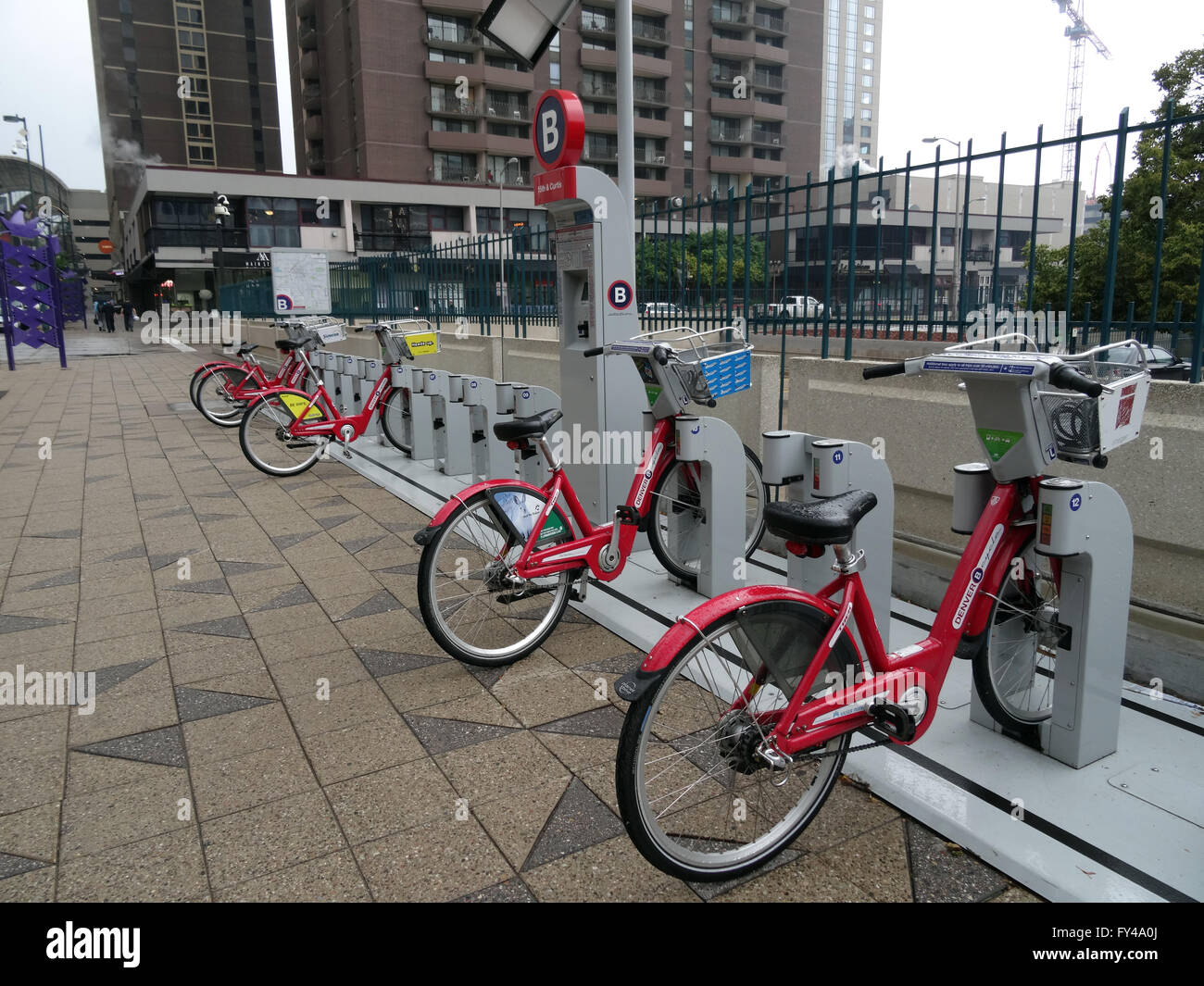 DENVER, COLORADO - JULY 7: Row of red bicycles at Bike Share station on ...