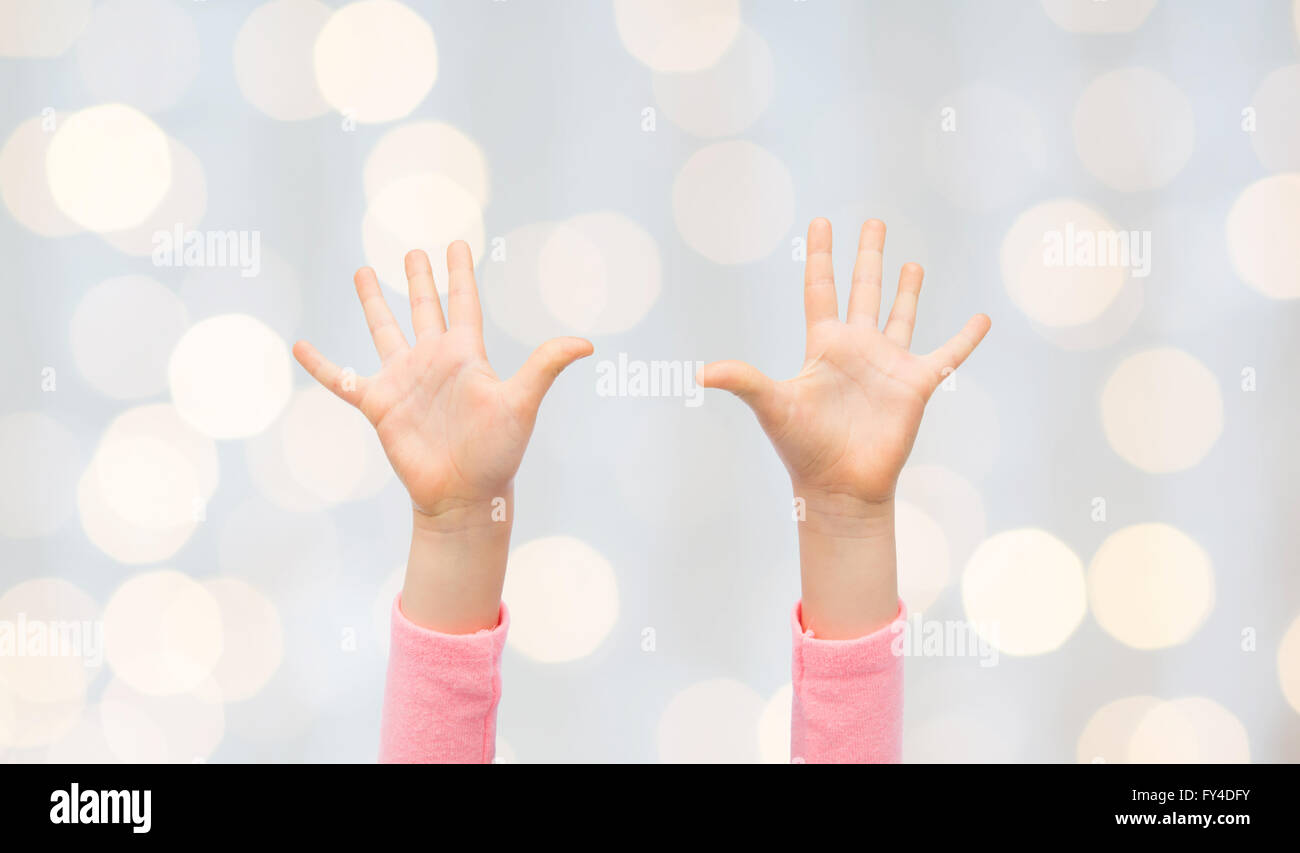 close up of little child hands raised upwards Stock Photo - Alamy